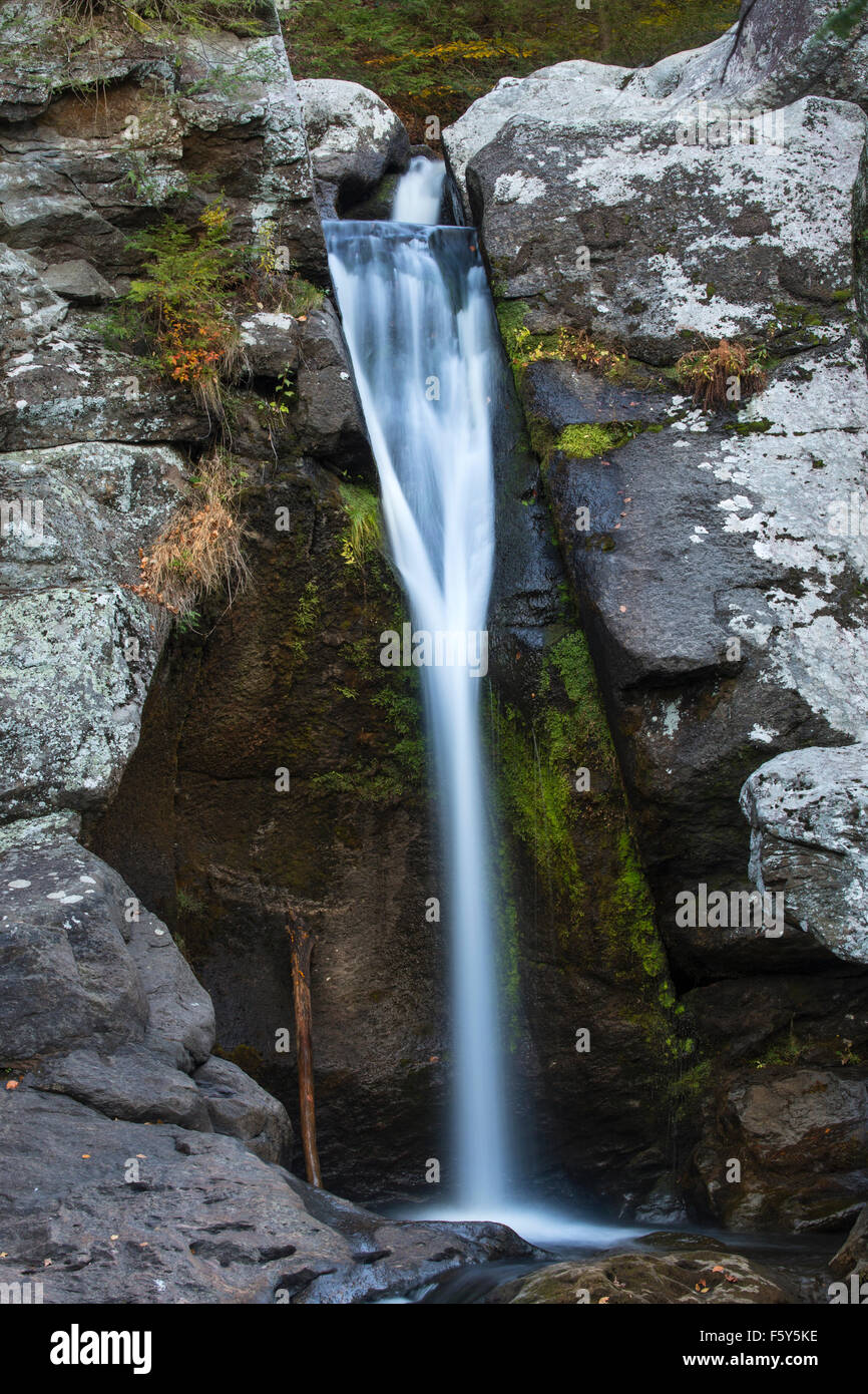 Long exposure of a waterfall over mossy granite ledges in the upper ...