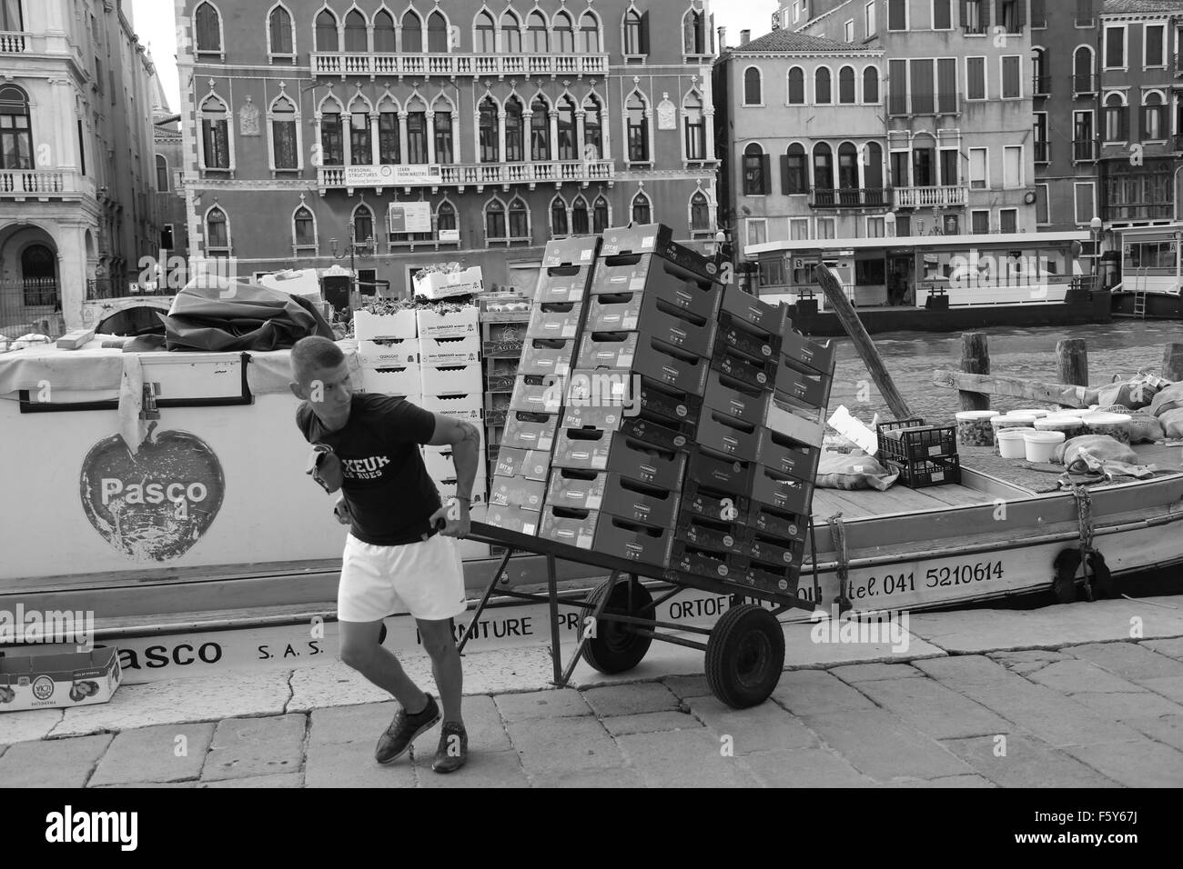 Guys using trolleys and carts to distribute goods to Café's and ...