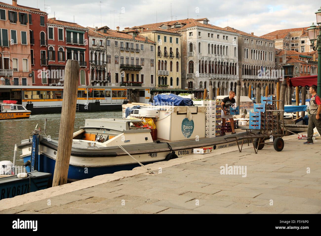 Guys using trolleys and carts to distribute goods to Café's and ...