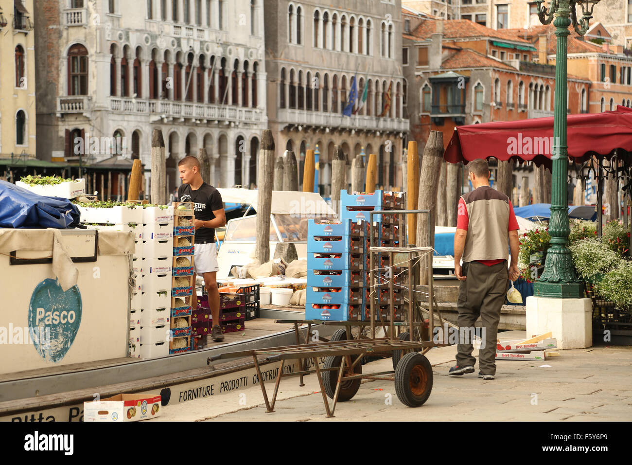 Guys using trolleys and carts to distribute goods to Café's and ...