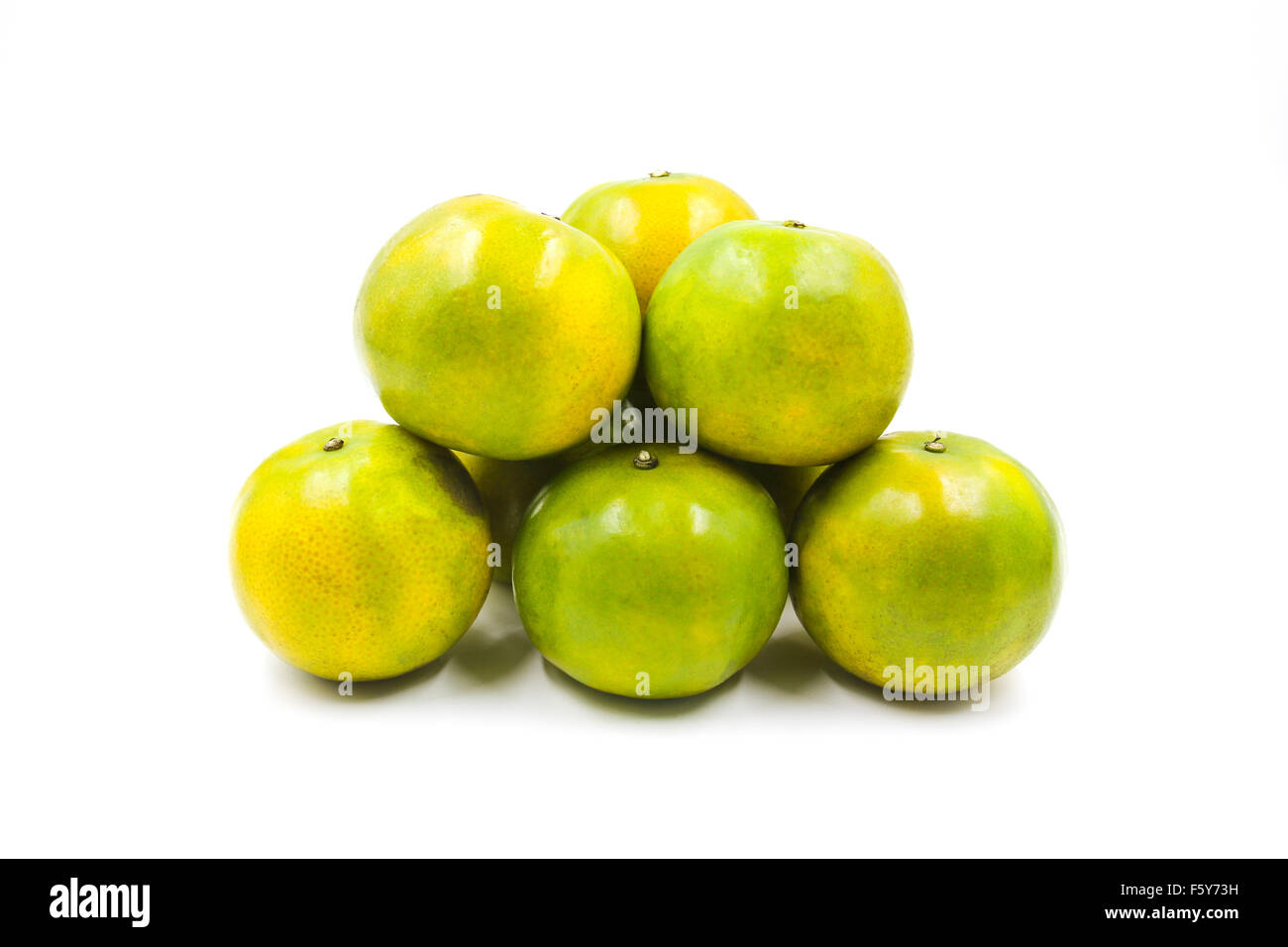 Fresh green tangerine isolated on white background Stock Photo - Alamy