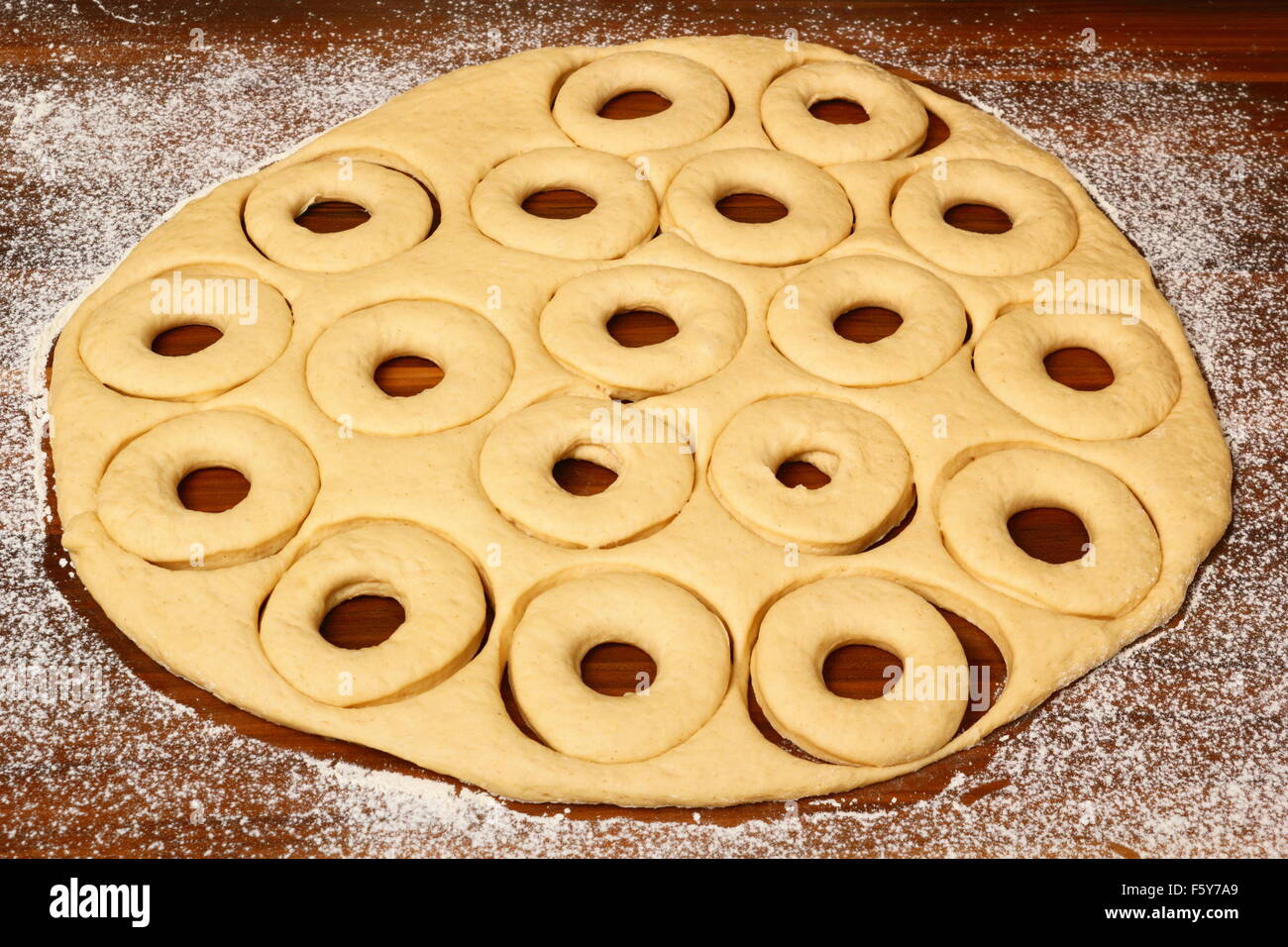 Cut Dough into ring. Making Doughnuts Stock Photo - Alamy