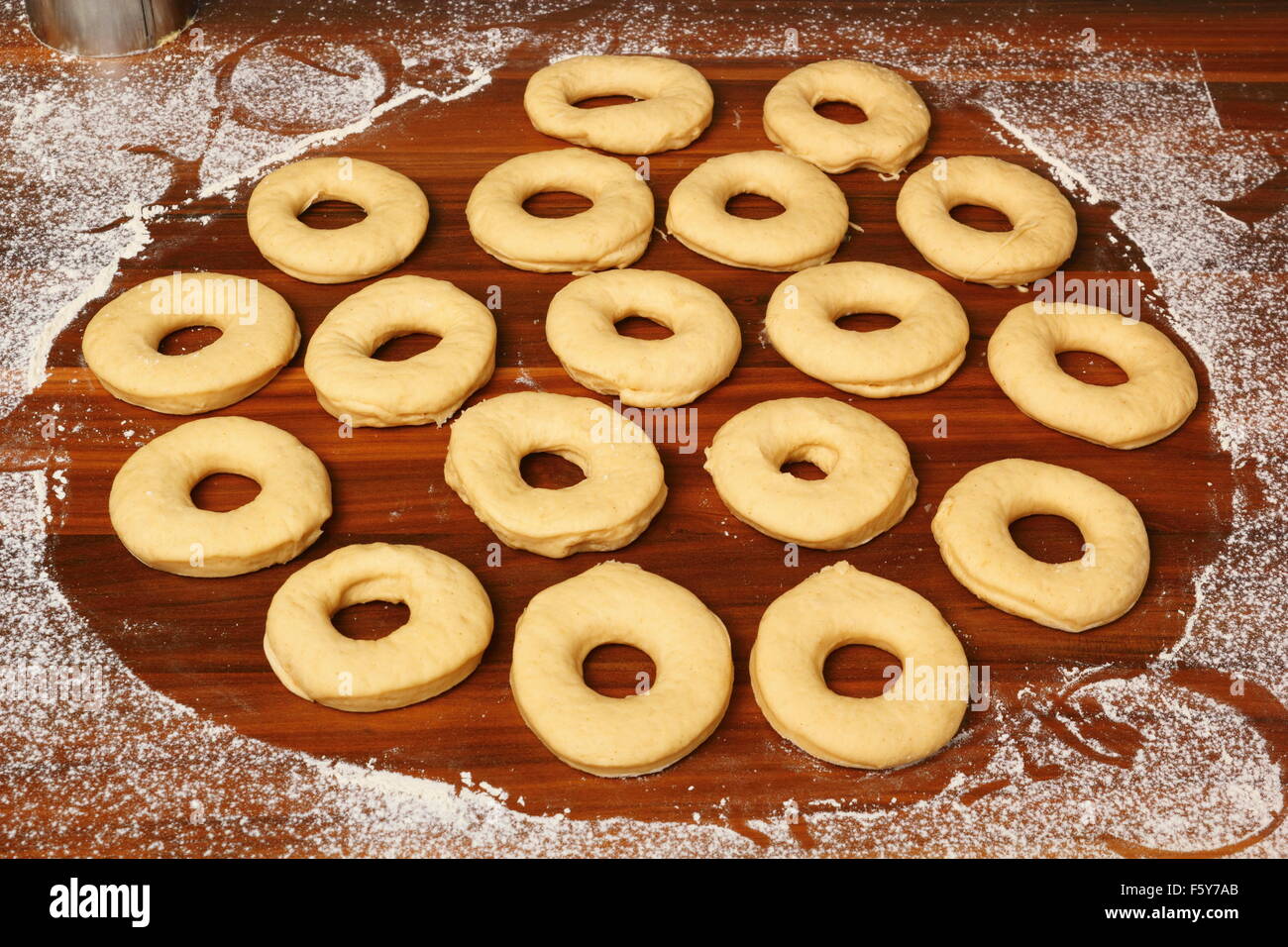 Cut Dough into ring. Making Doughnuts Stock Photo - Alamy