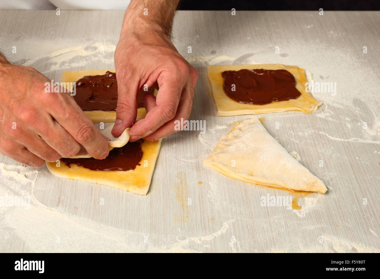 Folding over to form triangle. Making Chocolate Croissants with Puff ...