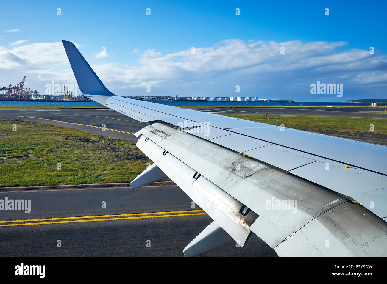 Sydney Airport Runway with views to Botany Bay Port facilities Stock ...