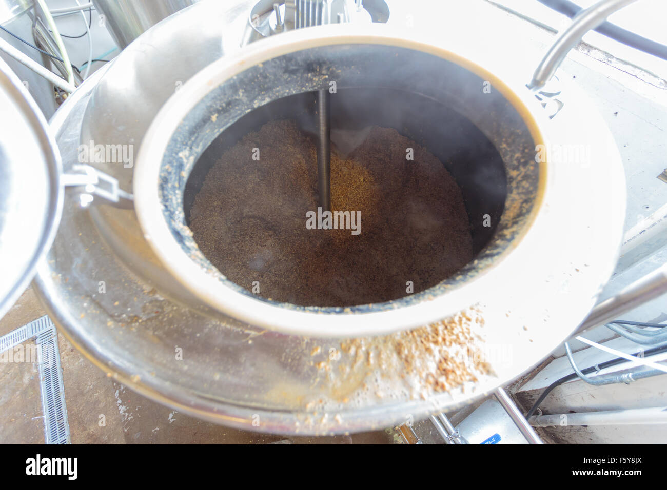 EUGENE, OR - NOVEMBER 4, 2015: Boiling all grain mash to create wort in ...