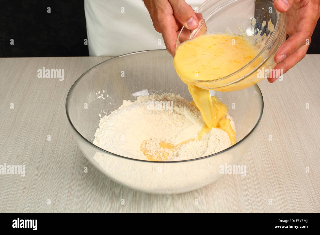 Preparing Dough, adding eggs mixture into bowl with flour. Making Yeast ...