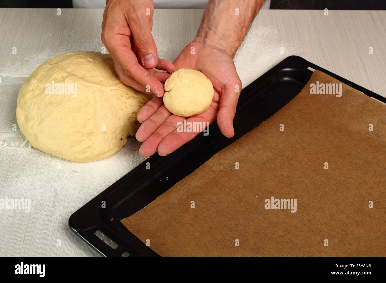 Baker preparing sweet buns hi-res stock photography and images - Alamy