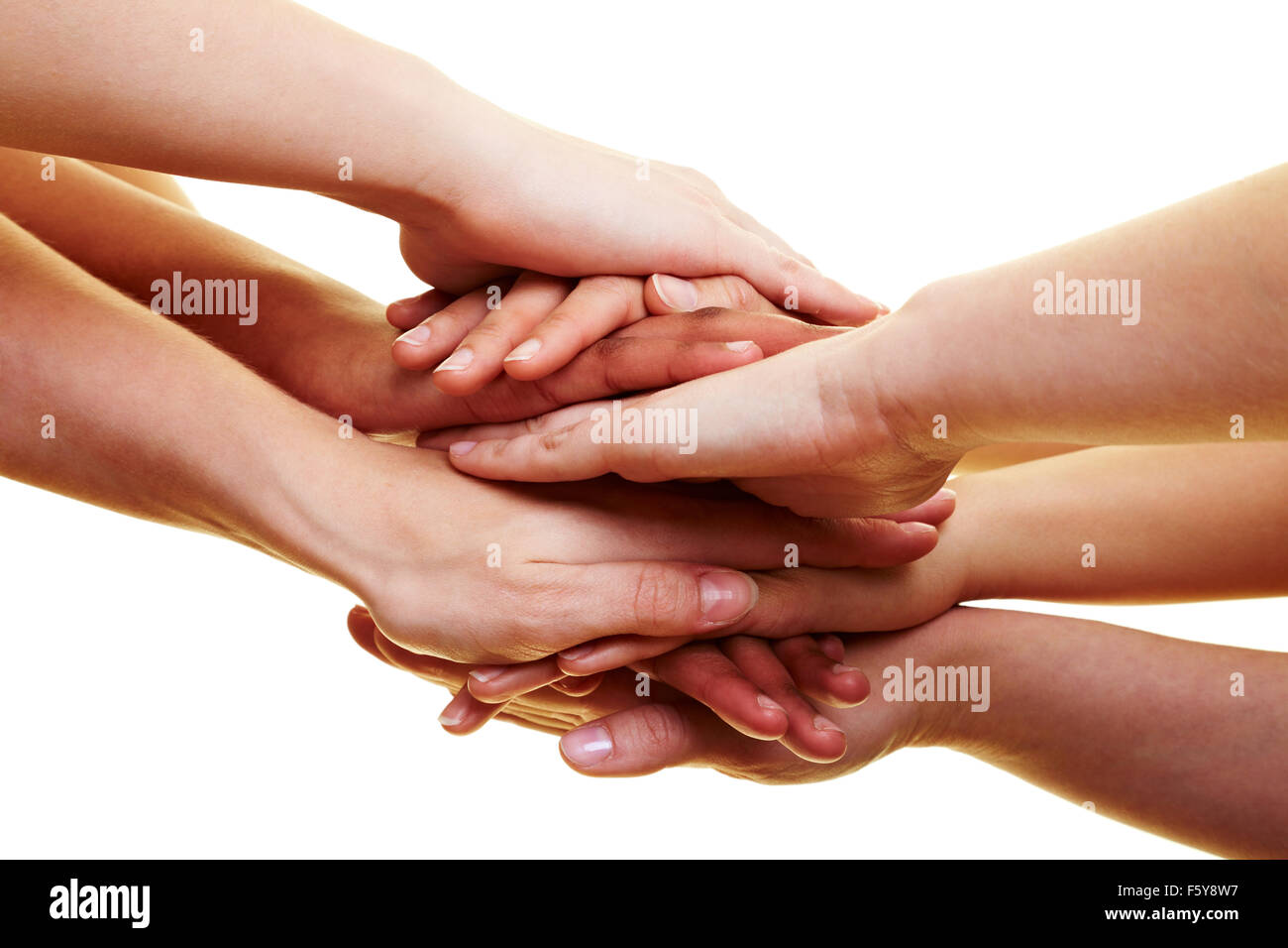 Many hands lying on top of each other Stock Photo - Alamy