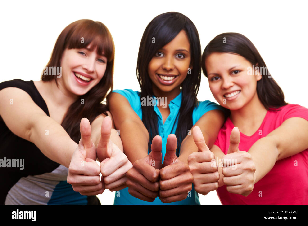 Three young happy woman showing their thumbs up Stock Photo - Alamy