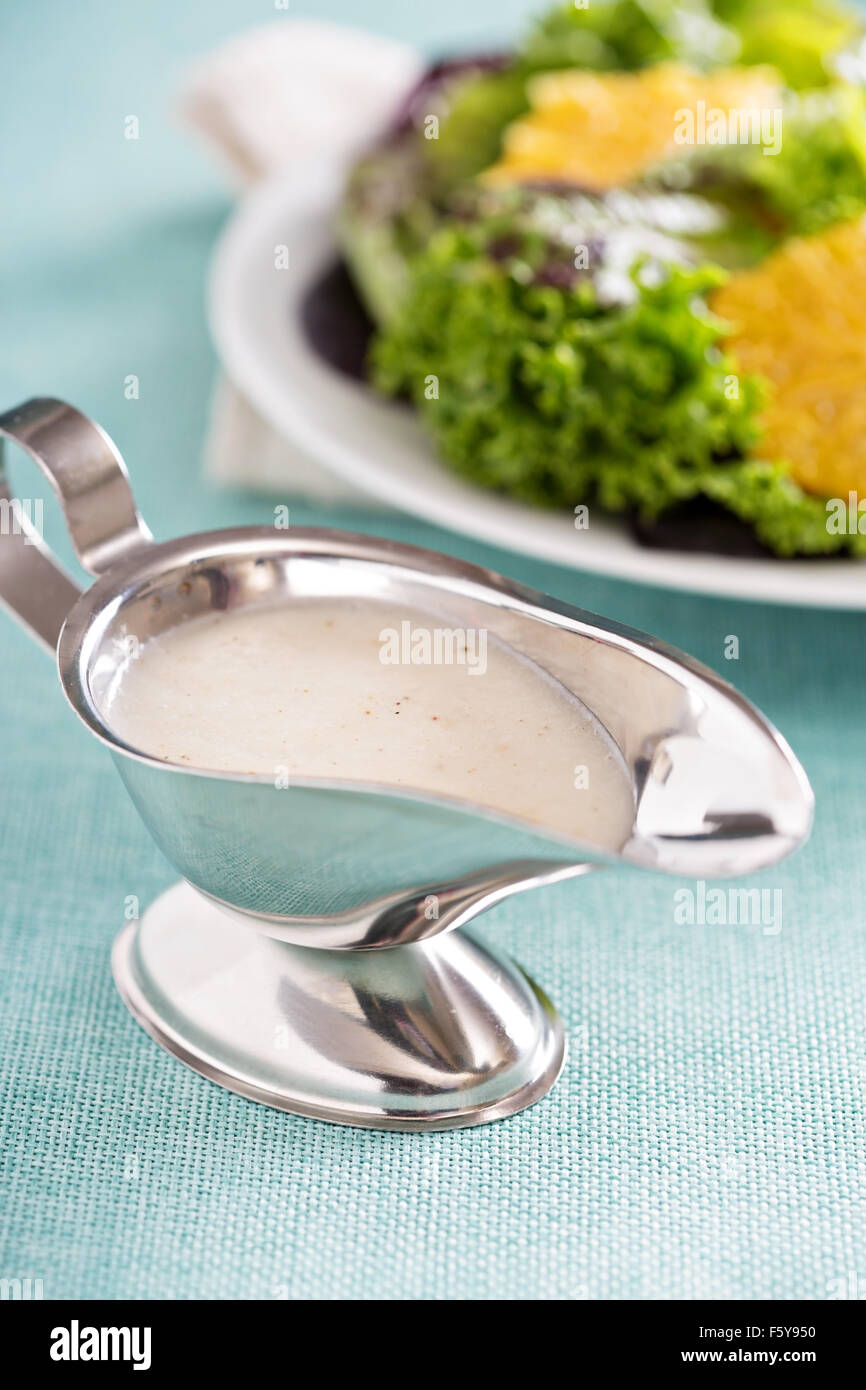 Creamy onion dressing in a small gravy dish Stock Photo - Alamy