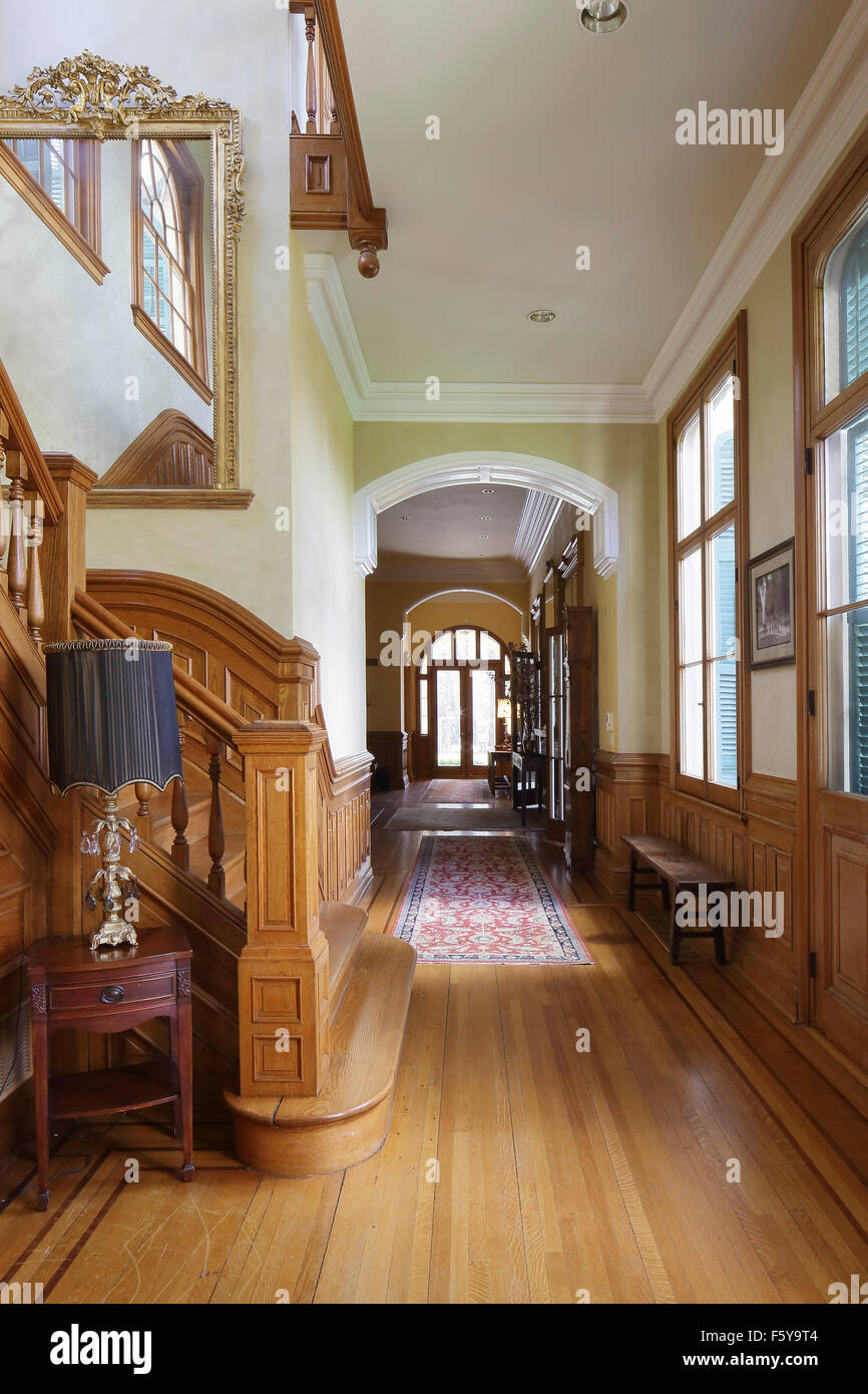 Front entrance hall with staircase; view toward front door. Clifton ...