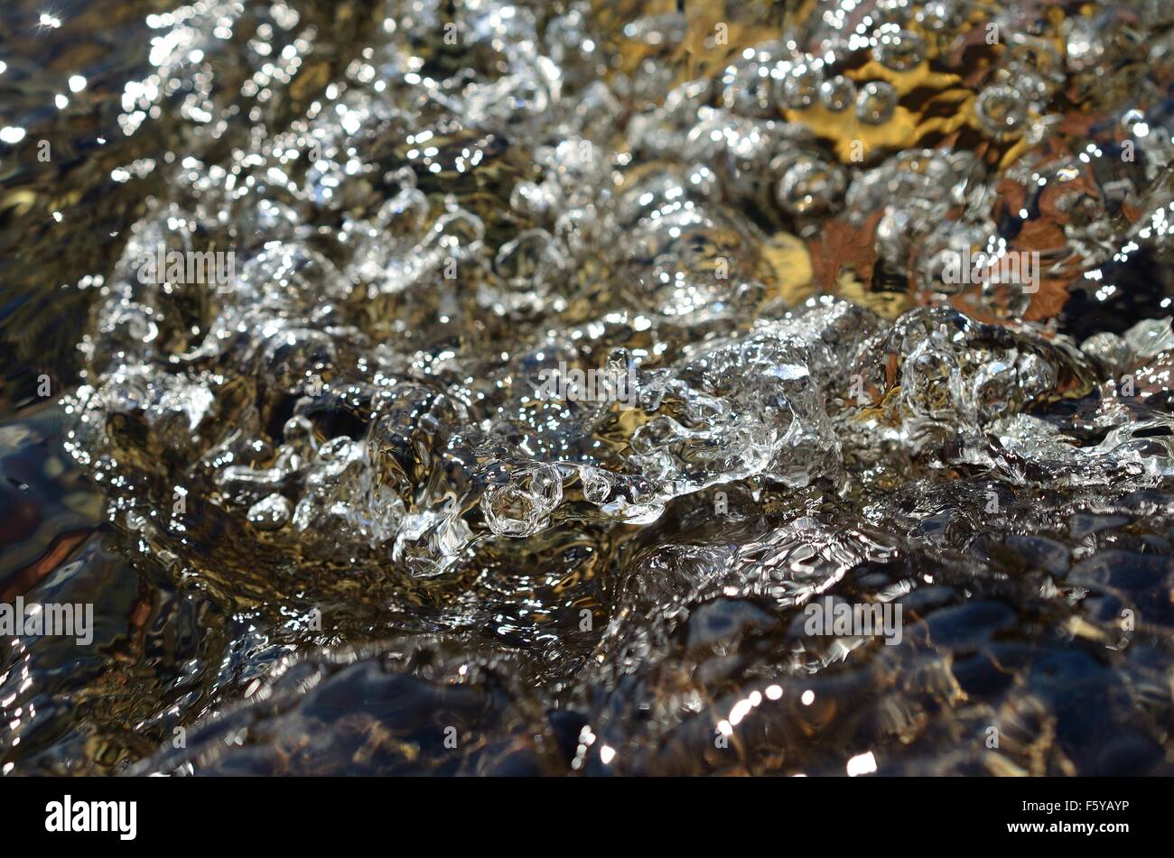 bubbly fresh river water flow macro photo background Stock Photo - Alamy