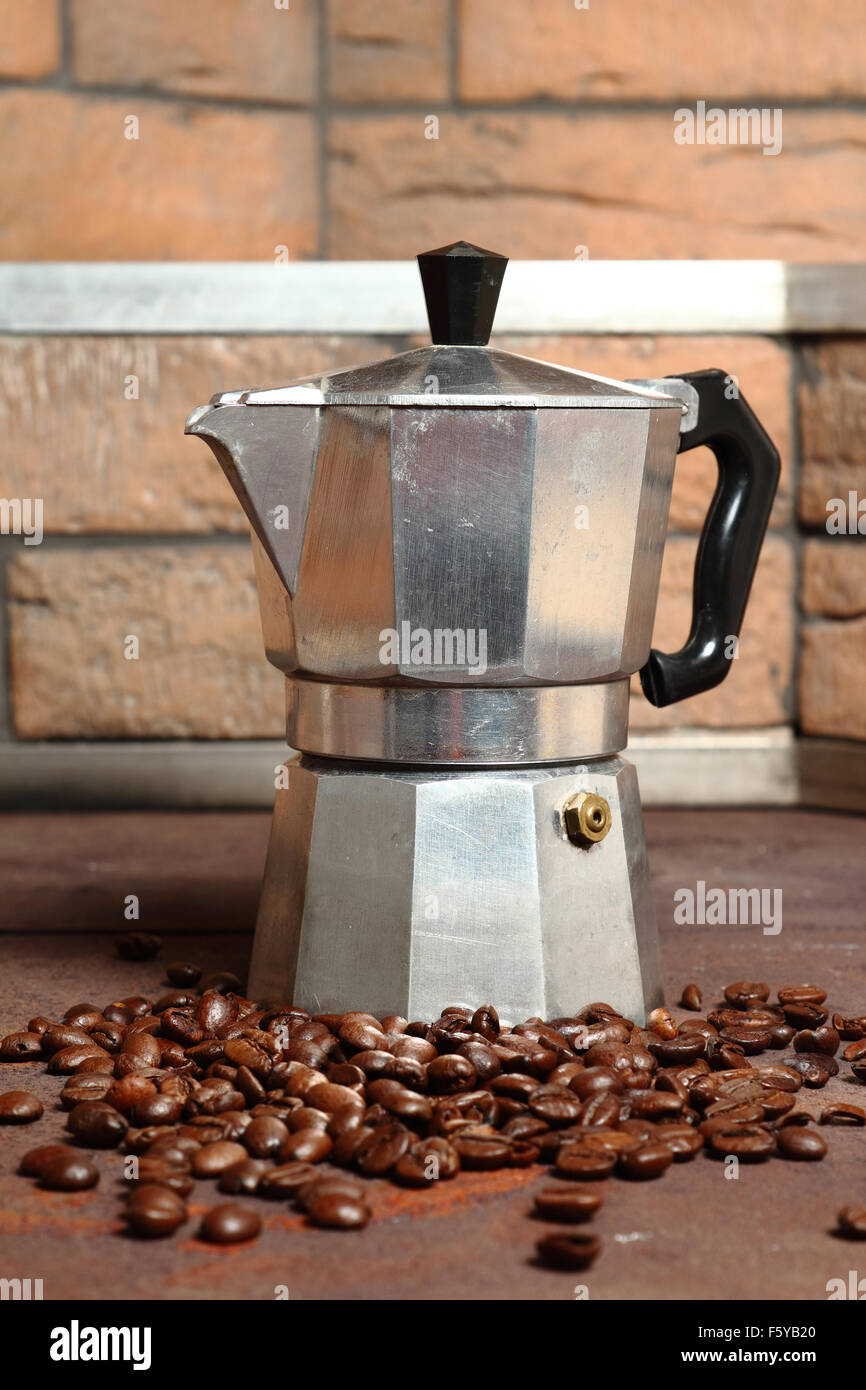 Moka pot and coffee beans Stock Photo - Alamy