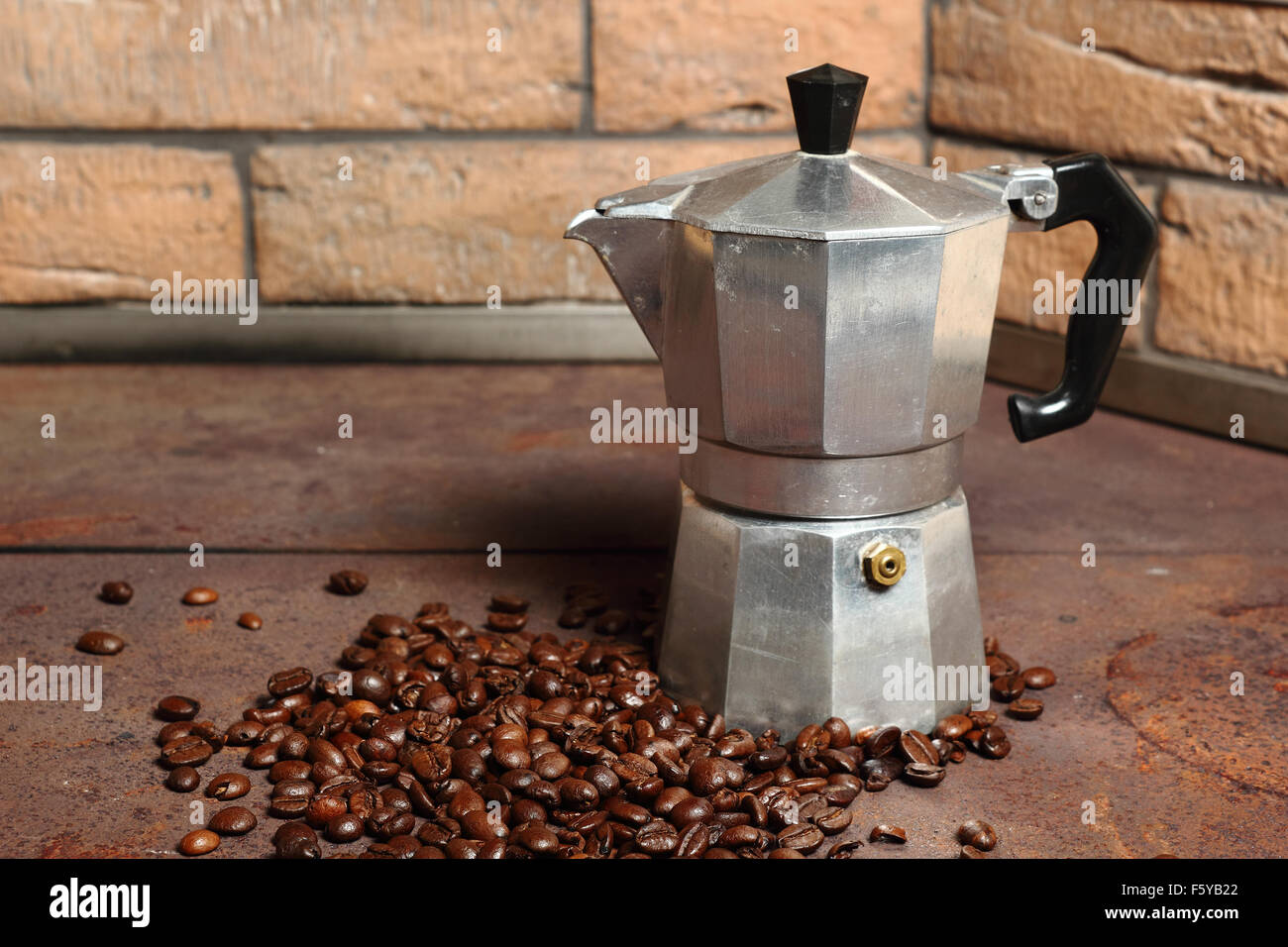 Moka pot and coffee beans Stock Photo - Alamy