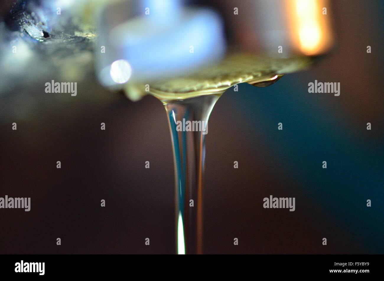 running fresh water kitchen tap macro Stock Photo - Alamy