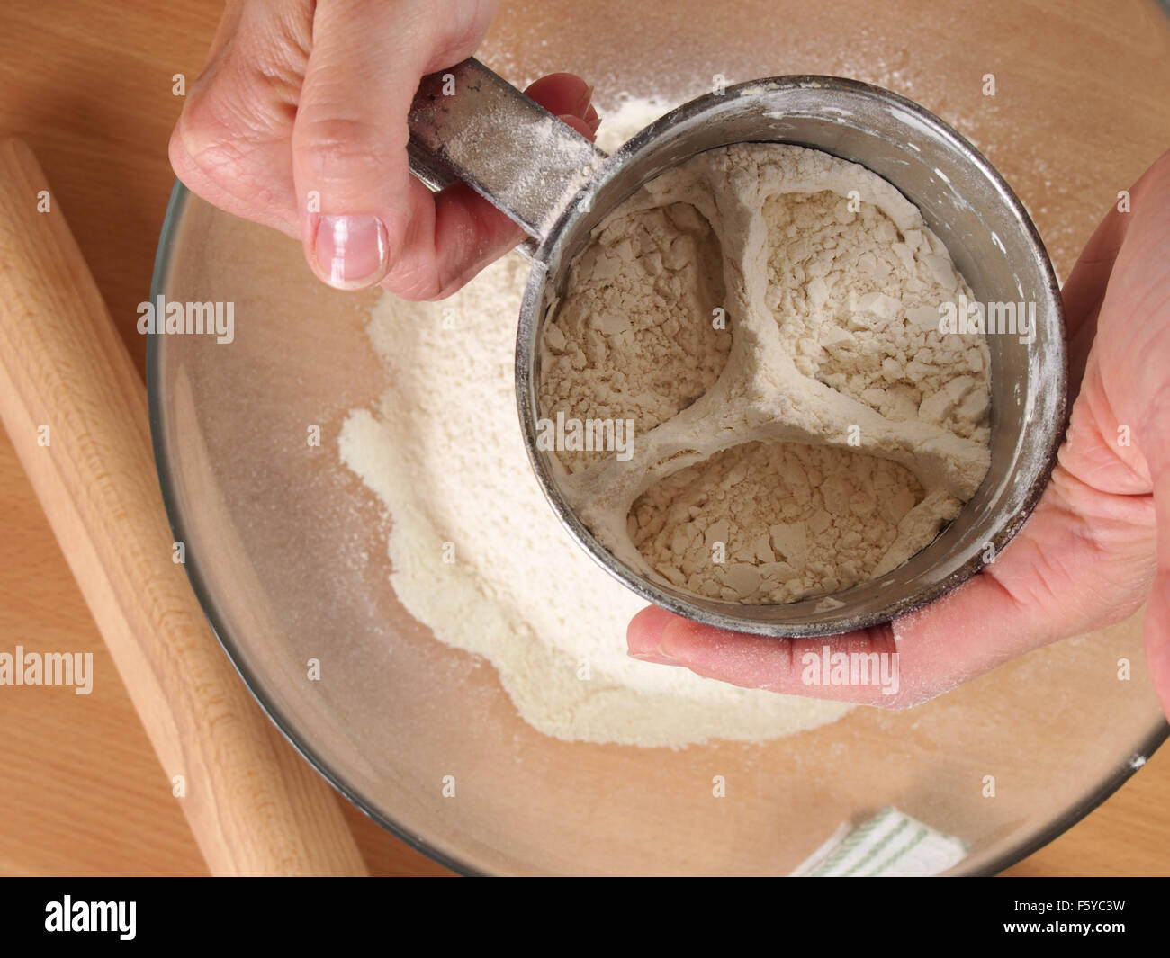 Sifting flour into bowl. Making Chocolate Layer Cake with Cream Cheese ...