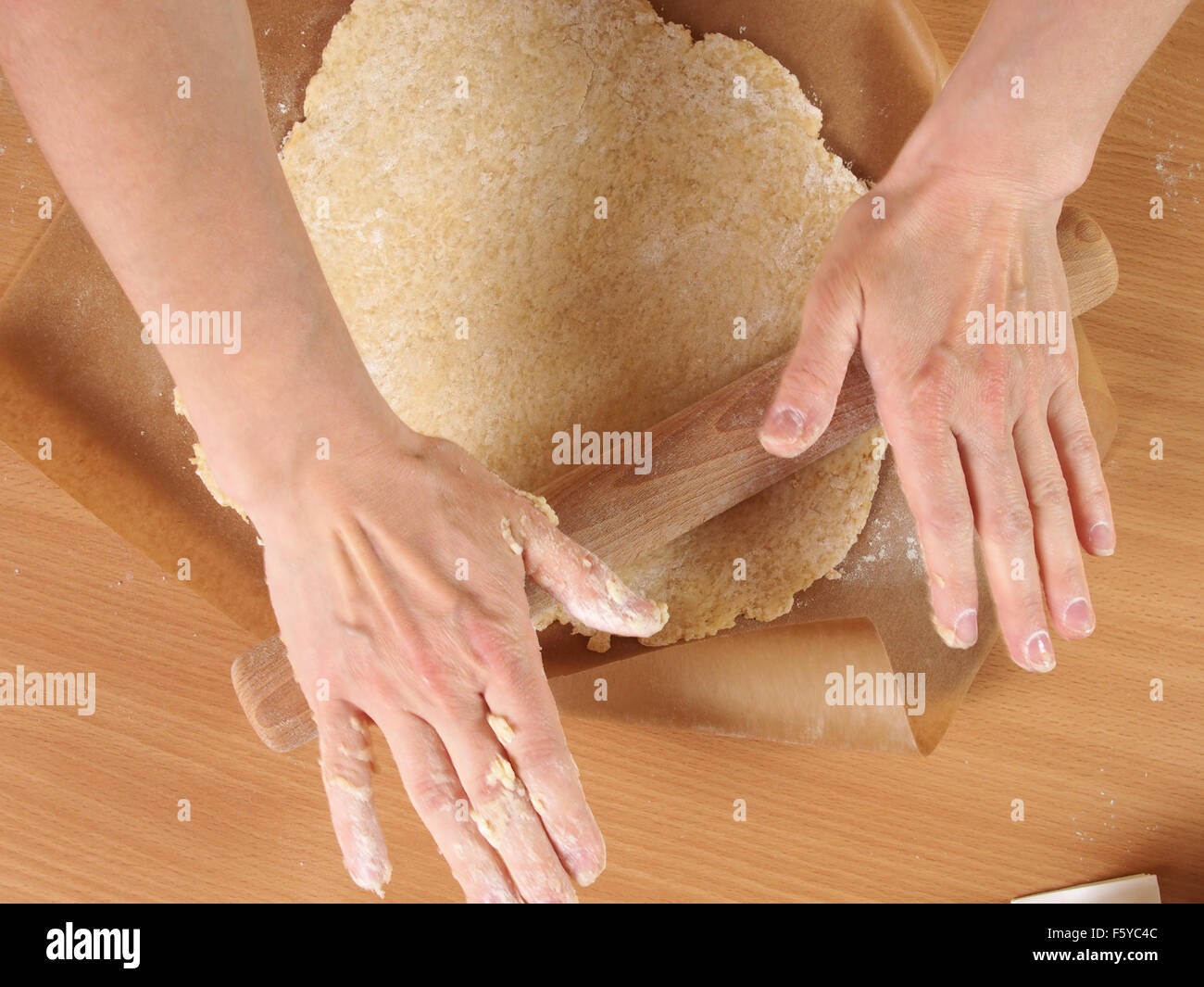 Rolling pastry to round. Making Chocolate Layer Cake with Cream Cheese ...