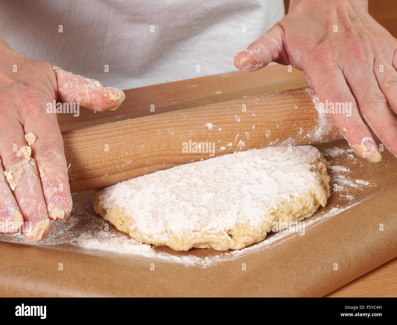 Rolling pastry to round. Making Chocolate Layer Cake with Cream Cheese ...