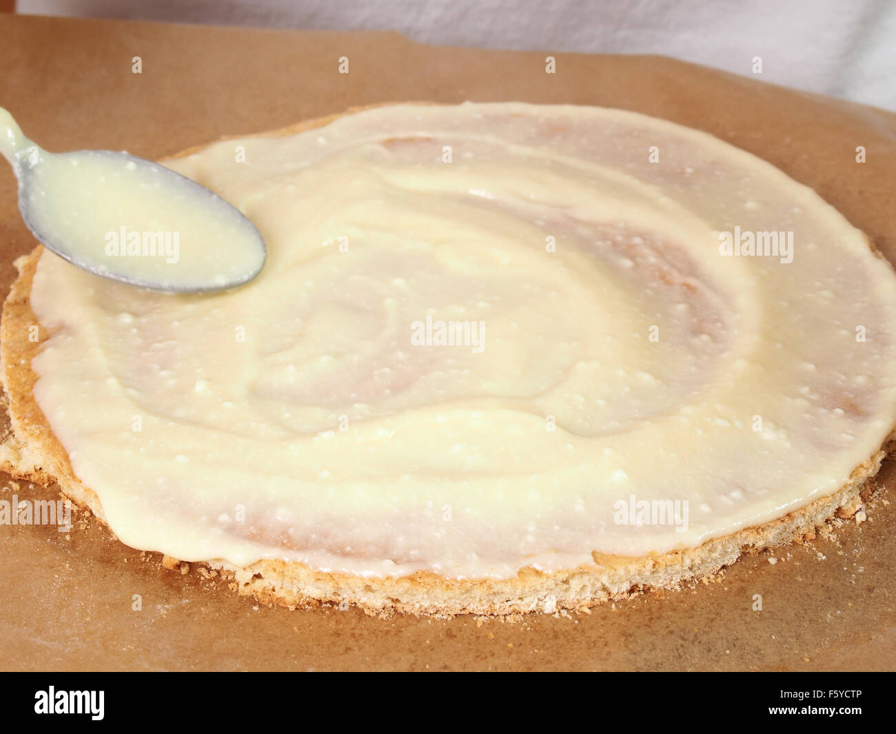 Filling cake layers. Making Chocolate Layer Cake with Cream Cheese ...