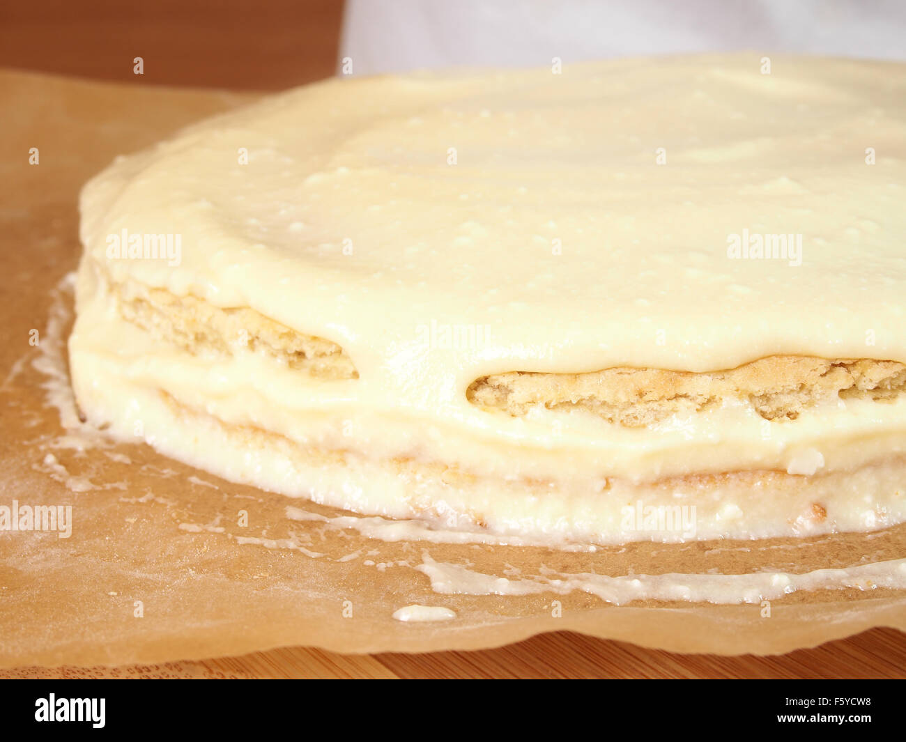 Filling cake layers. Making Chocolate Layer Cake with Cream Cheese ...