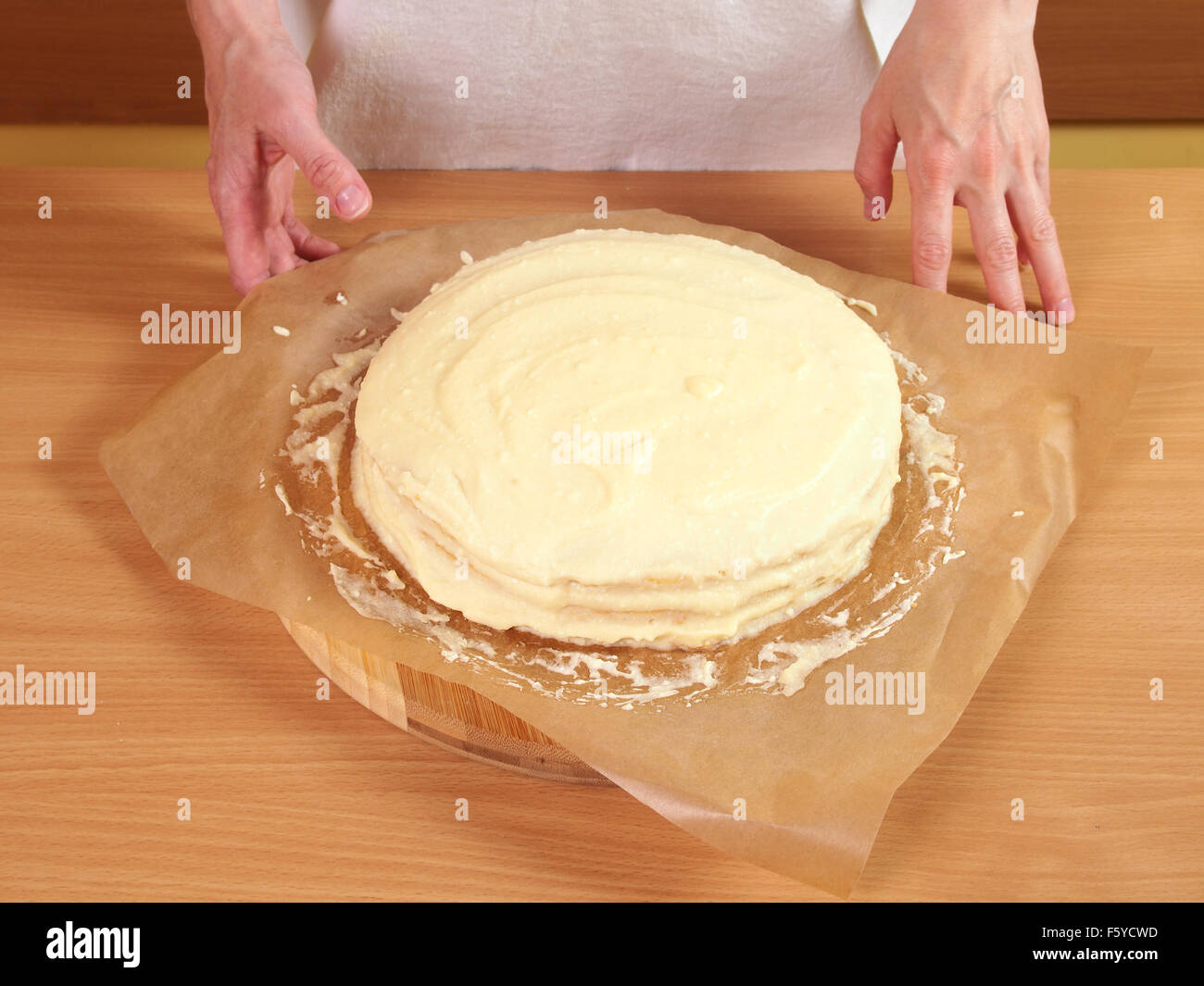 Filling cake layers. Making Chocolate Layer Cake with Cream Cheese ...