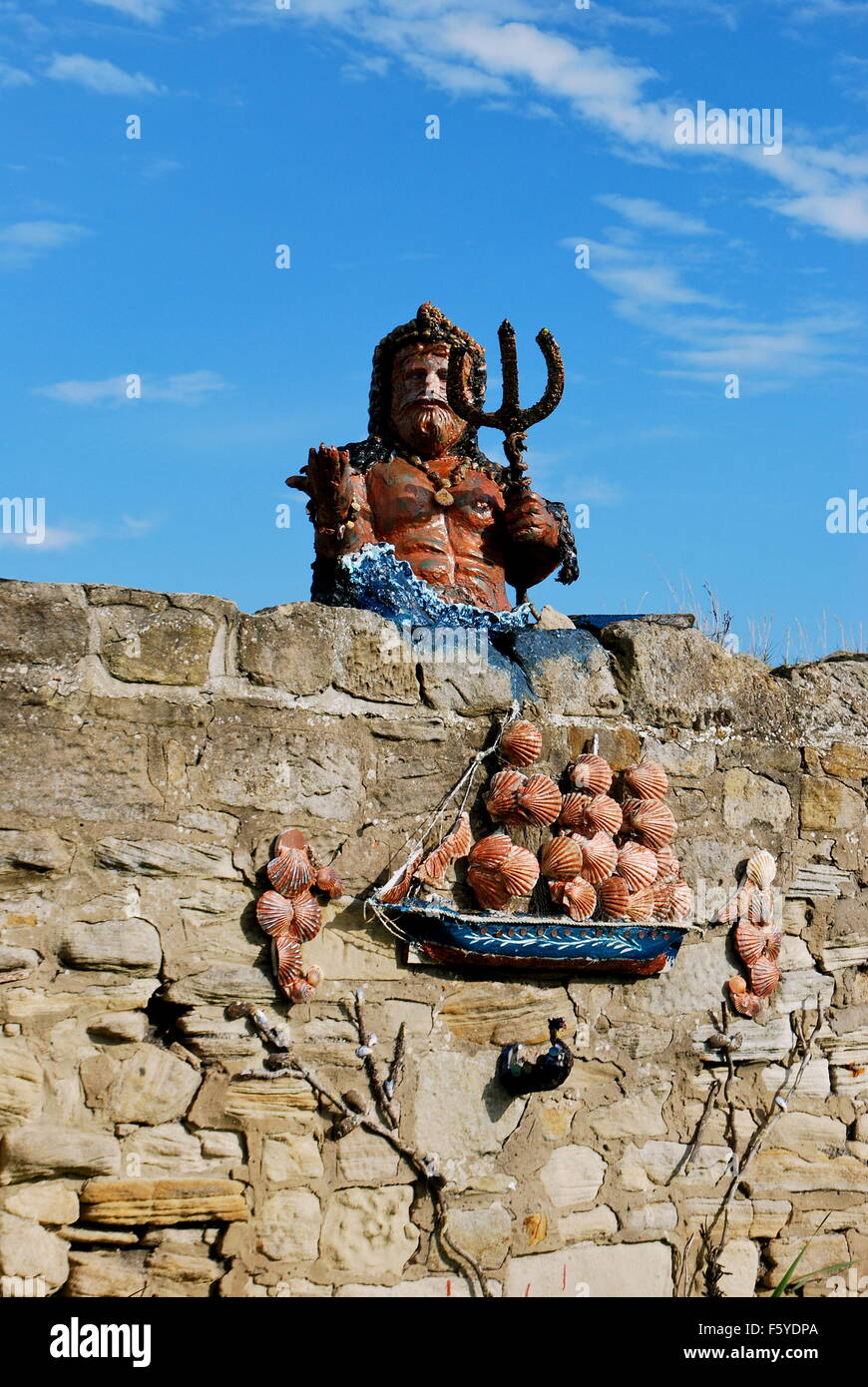 Neptune and boat sculpture on rock wall Stock Photo - Alamy