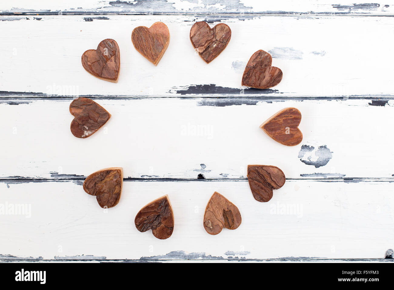 objects of bark shaped as hearts in a circle on vintage wooden ...