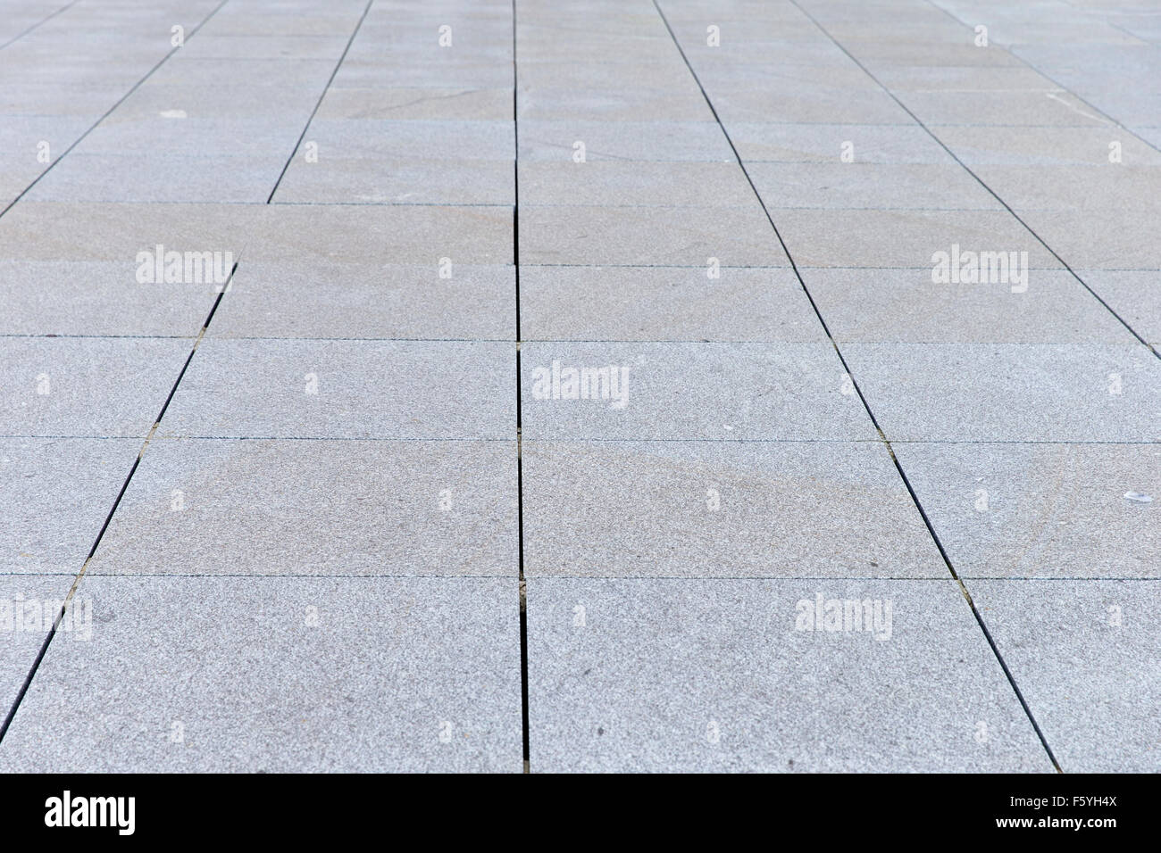 Old and antique granite tiles floor Stock Photo - Alamy