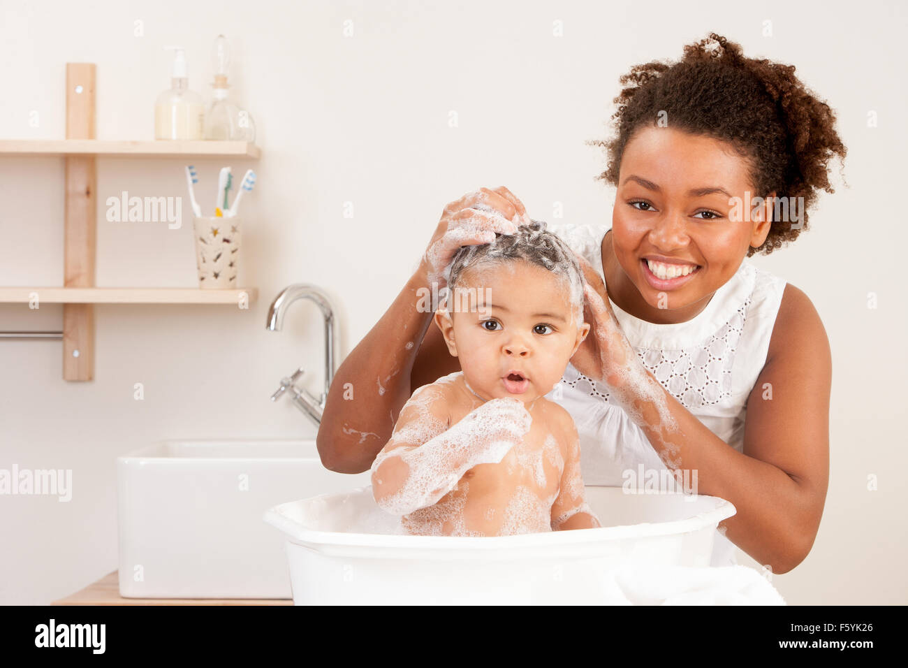 Mother bathing son hi-res stock photography and images - Alamy