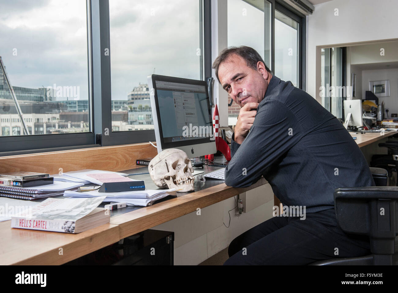 Writer Anthony Horowitz at desk in his home office Stock Photo - Alamy