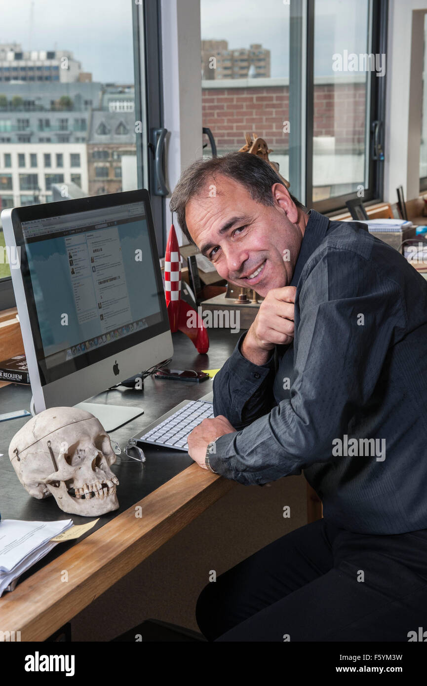 Writer Anthony Horowitz at desk in his home office Stock Photo - Alamy
