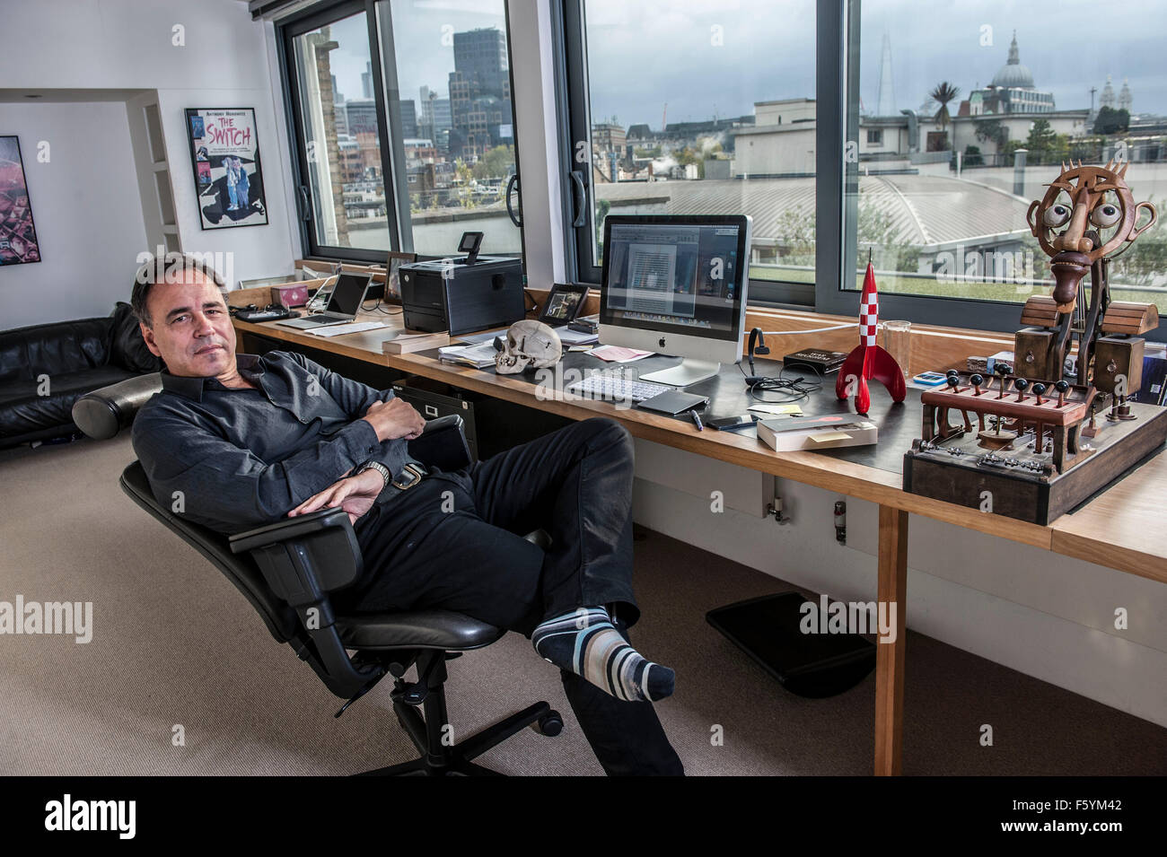 Writer Anthony Horowitz at desk in his home office Stock Photo - Alamy