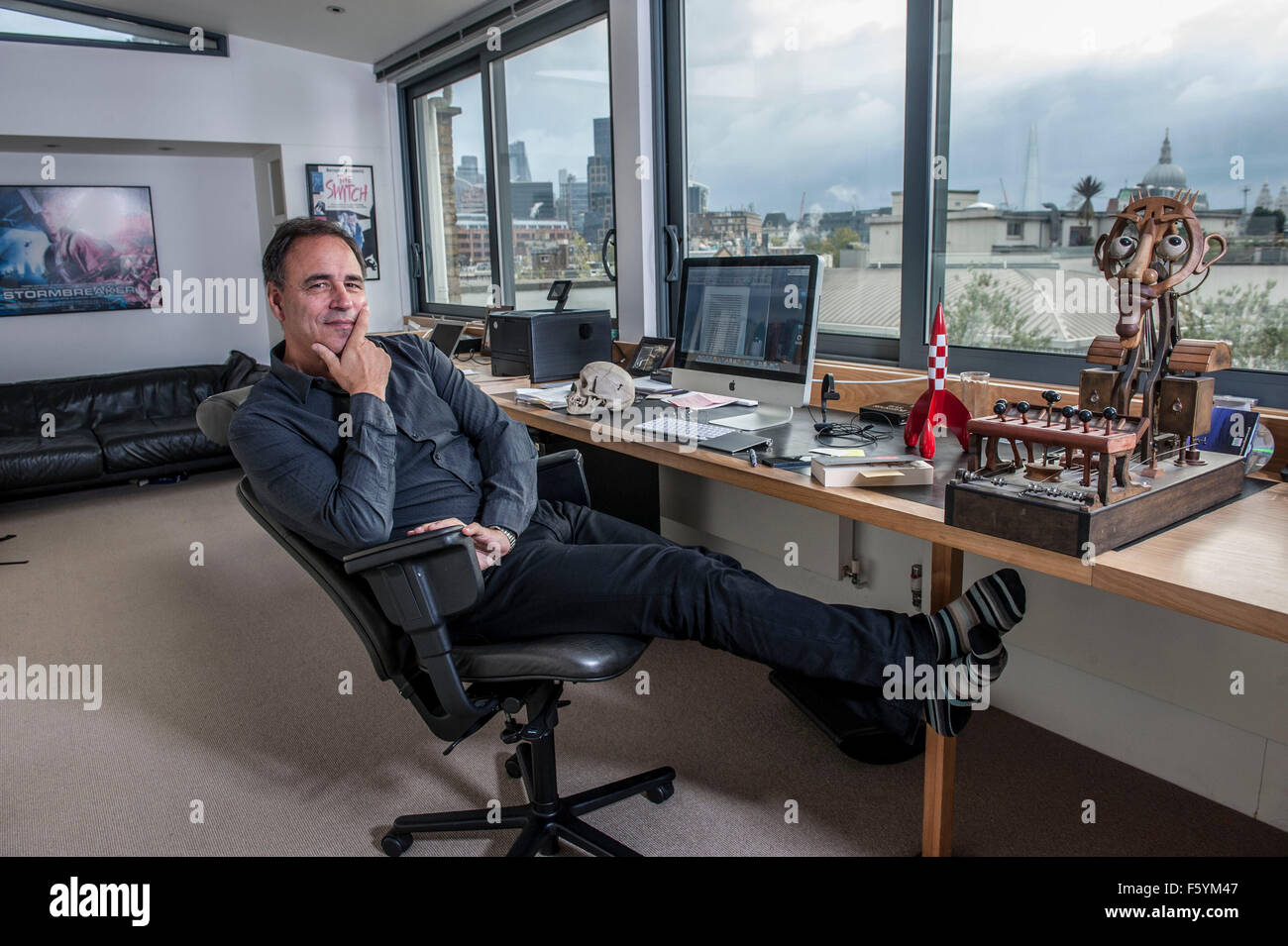 Writer Anthony Horowitz at desk in his home office Stock Photo - Alamy