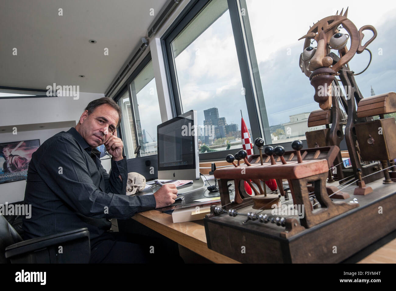 Writer Anthony Horowitz at desk in his home office Stock Photo - Alamy