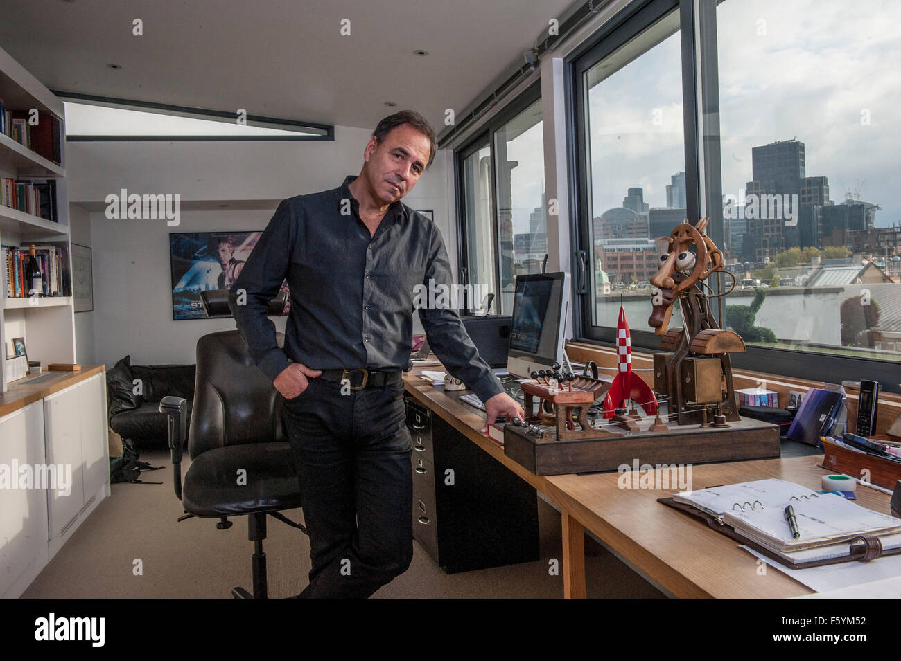 Writer Anthony Horowitz at desk in his home office Stock Photo - Alamy