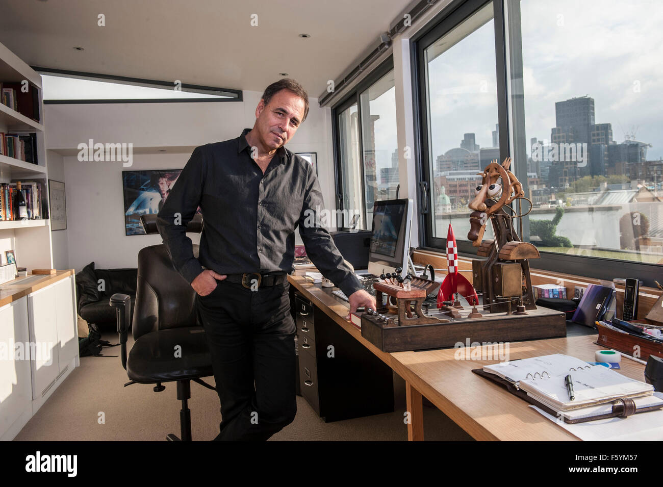 Writer Anthony Horowitz at desk in his home office Stock Photo - Alamy