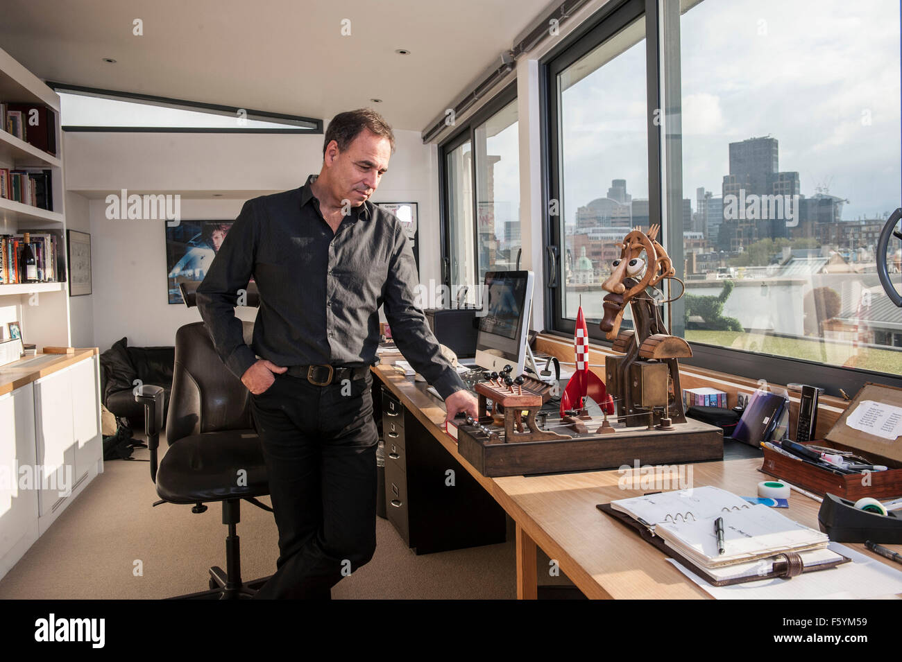 Writer Anthony Horowitz at desk in his home office Stock Photo - Alamy