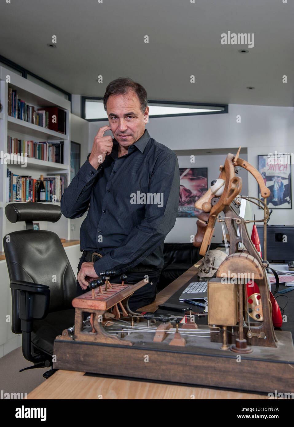 Writer Anthony Horowitz at desk in his home office Stock Photo - Alamy