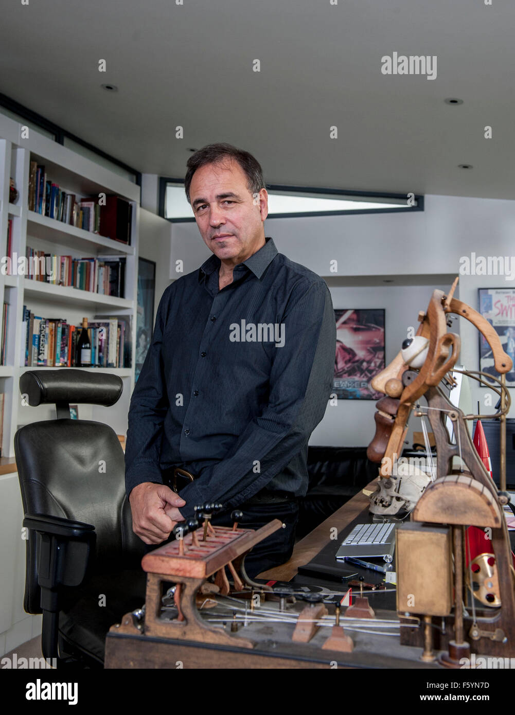 Writer Anthony Horowitz at desk in his home office Stock Photo - Alamy