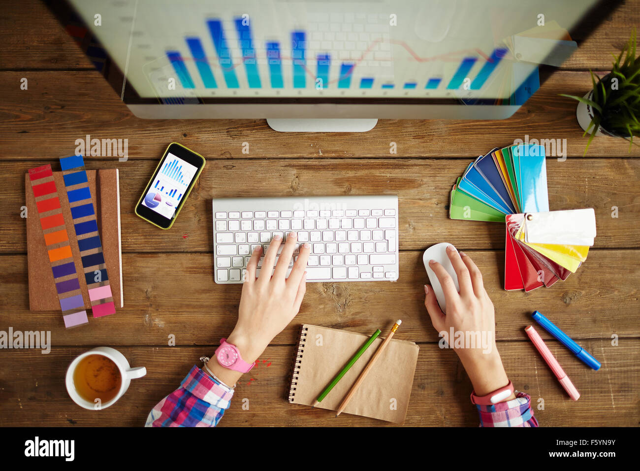 Hands of designer typing by computer Stock Photo - Alamy