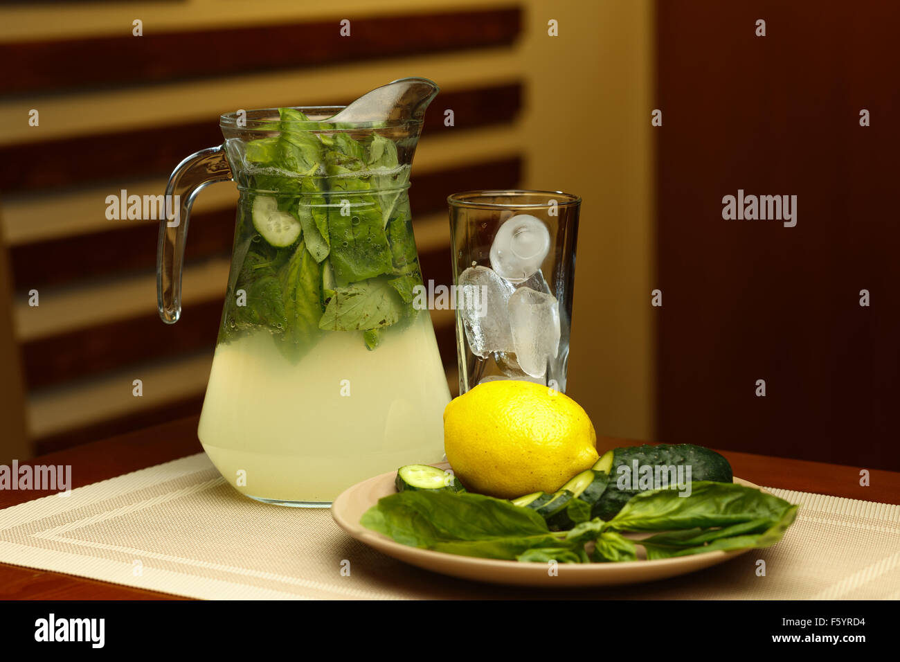Glass of sweet lemonade with jar and ingredients Stock Photo - Alamy
