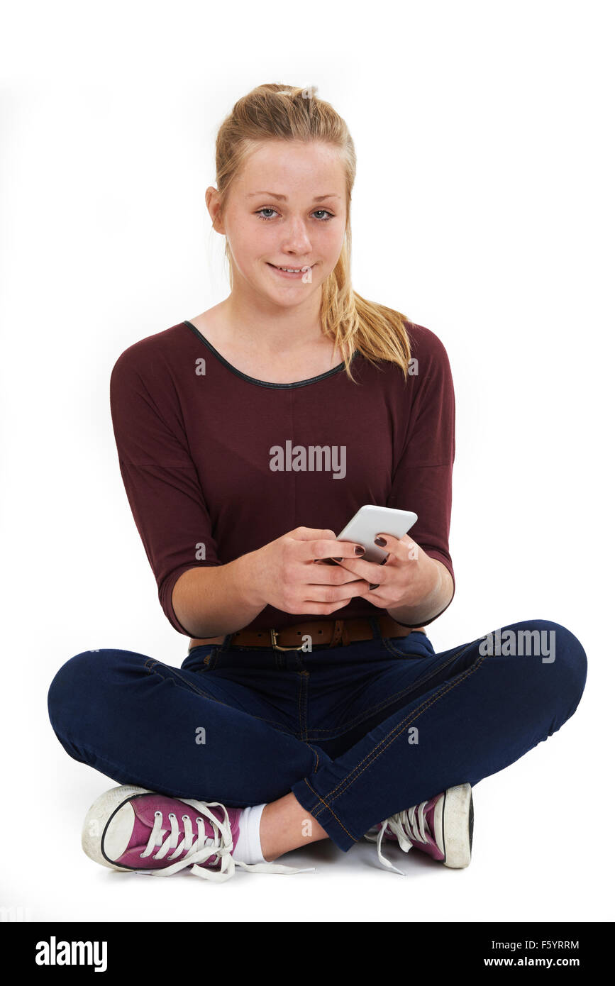 Studio Shot Of Teenage Girl Sending Text Message Stock Photo - Alamy