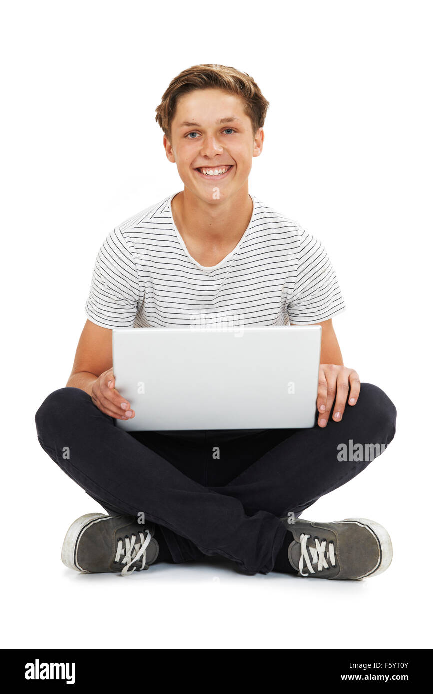Studio Shot Of Teenage Boy Using Laptop Stock Photo - Alamy