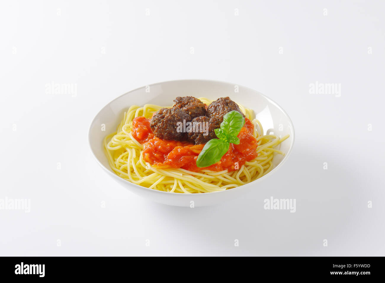 Spaghetti and meatballs in bowl pile hi-res stock photography and ...