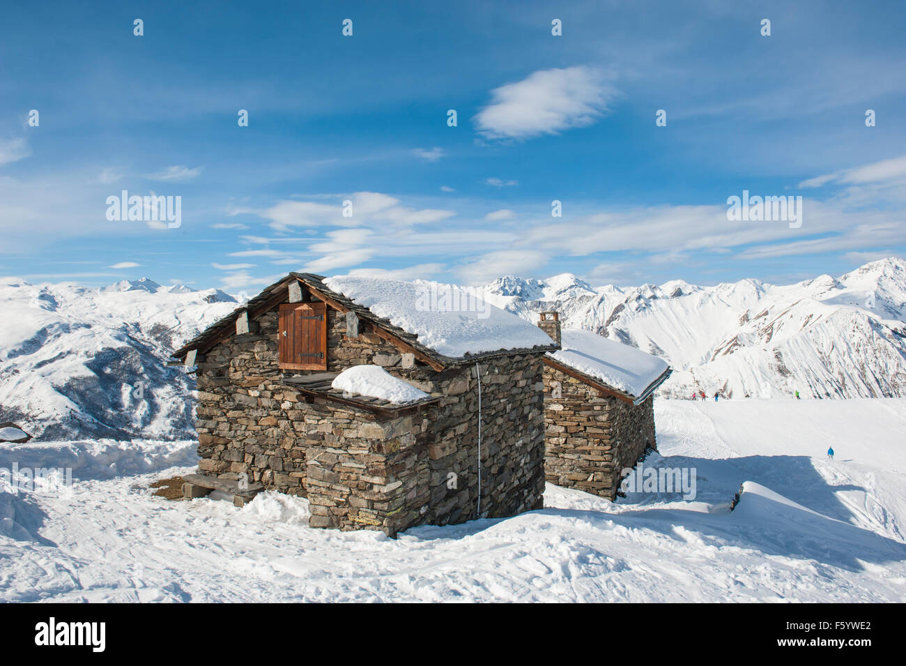 Remote stone mountain hut on an alpine slope covered in snow Stock ...