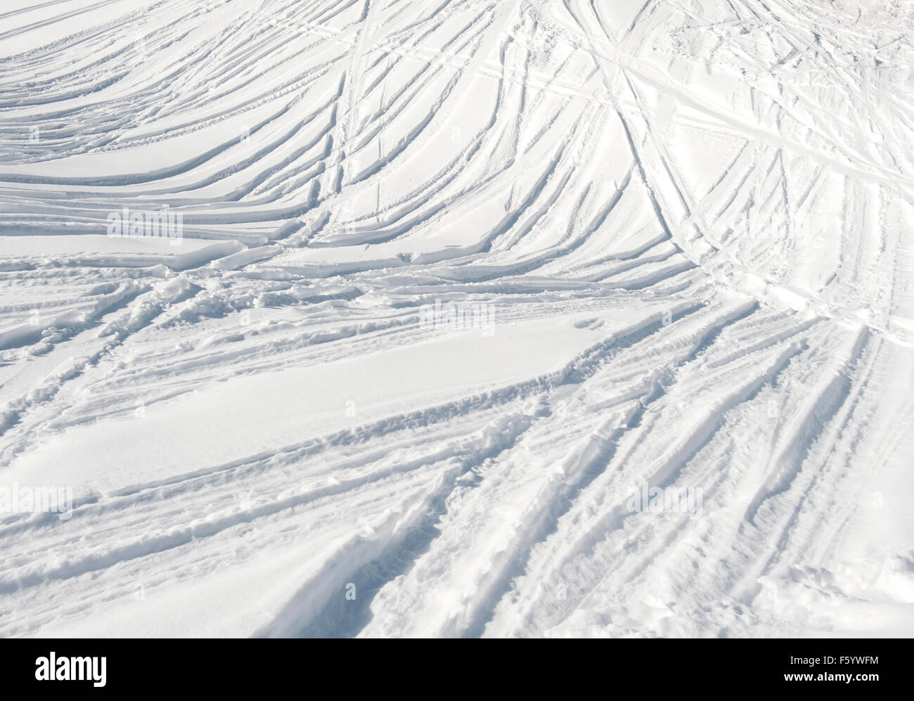 Series of ski tracks in the snow on alpine winter piste Stock Photo - Alamy