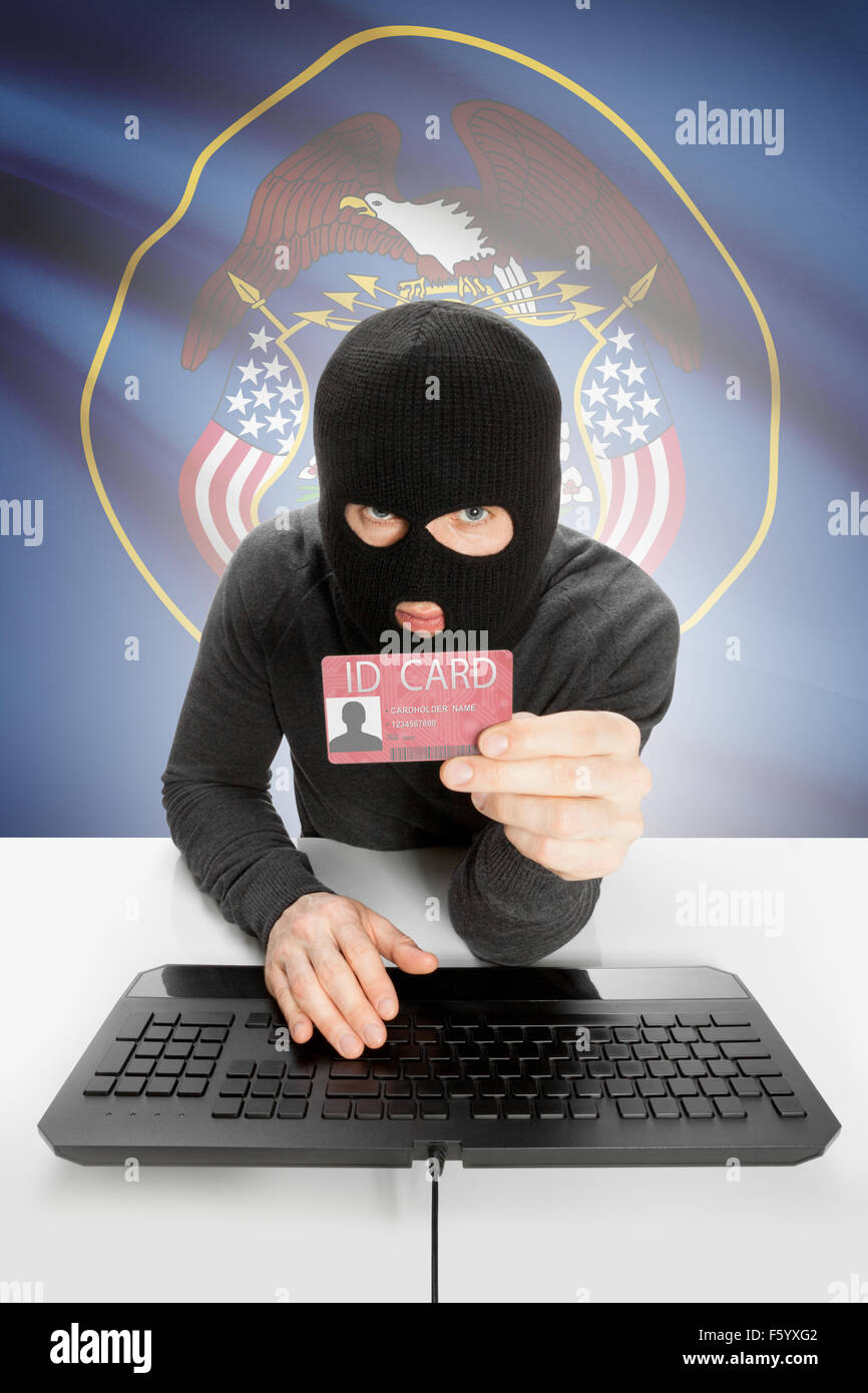 Hacker with ID card in hand and USA states flag on background - Utah ...