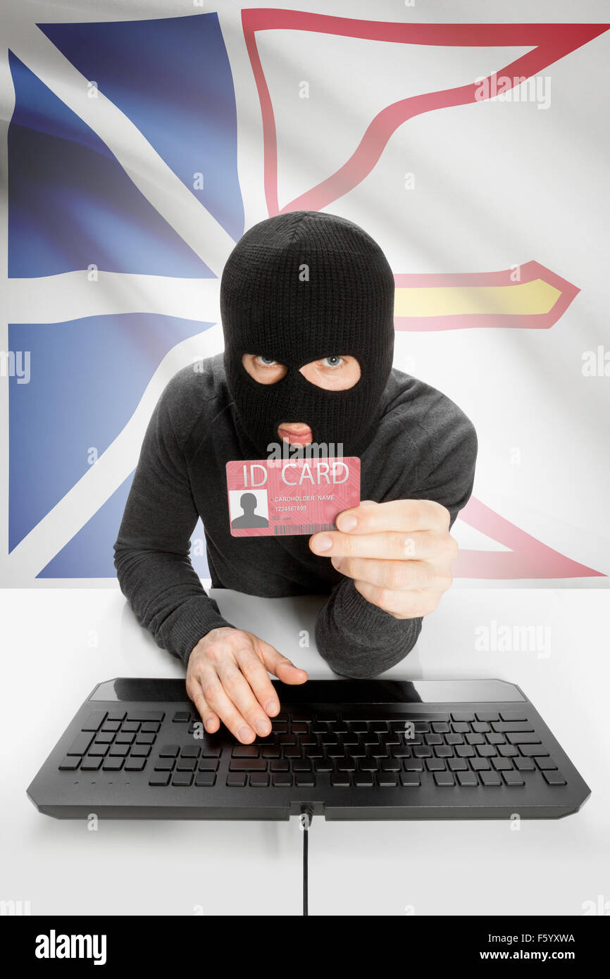 Hacker with ID card in hand and Canadian province flag on background ...