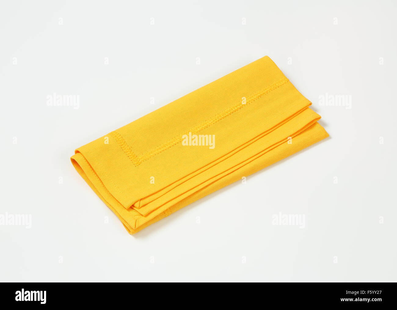 yellow place mat on white background Stock Photo - Alamy